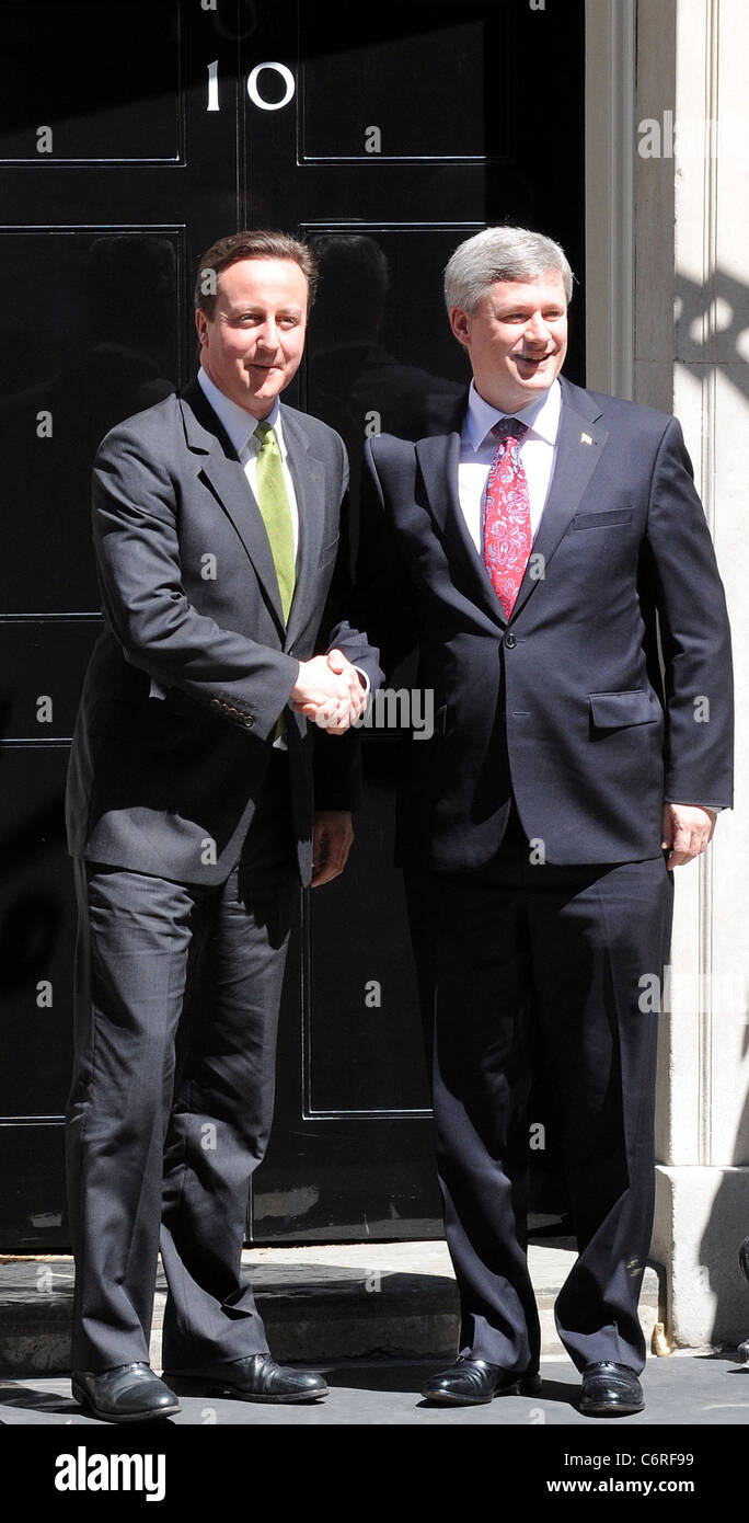 Prime minister David Cameron shaking hands with Canadian Prime Minster ...