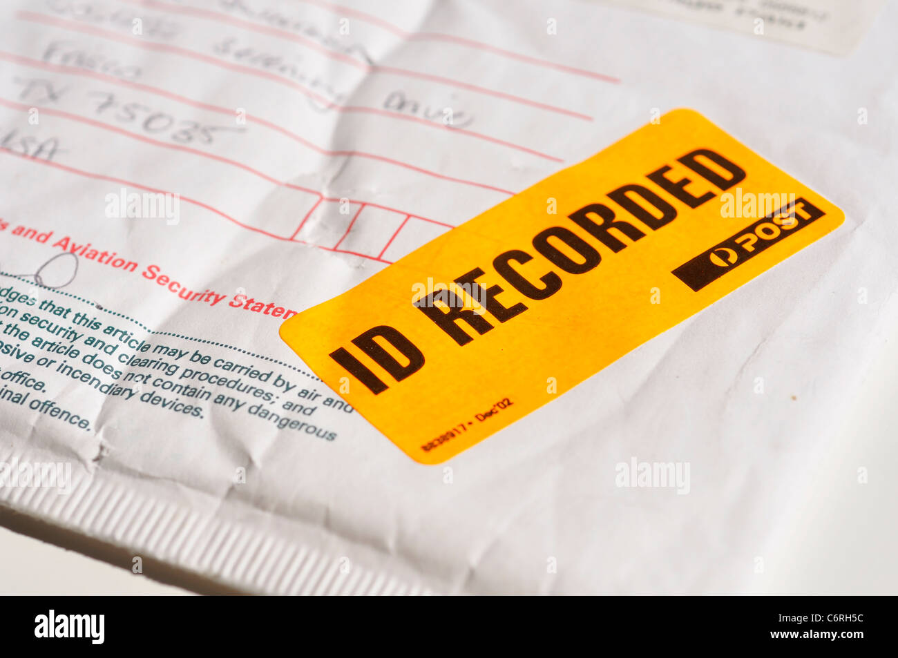 ID RECORDED sticker on mail package envelope Stock Photo - Alamy
