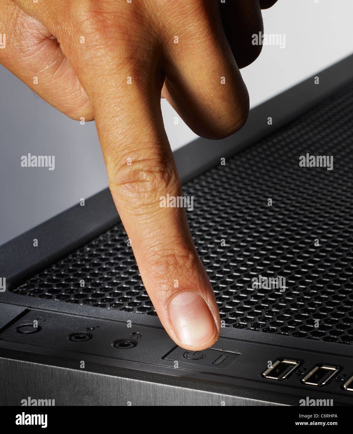 Finger pushing a button on a pc Stock Photo - Alamy