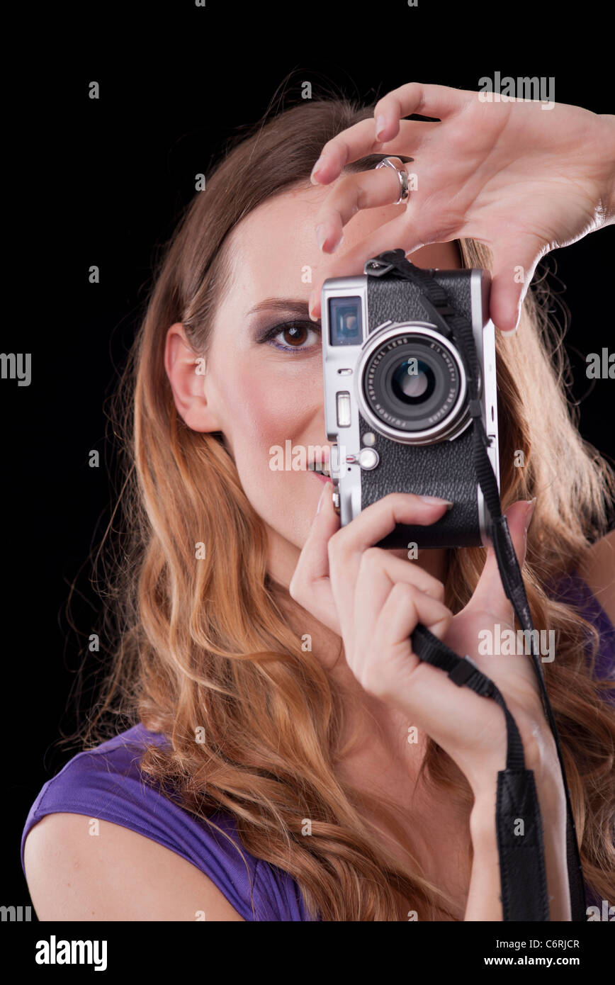 woman taking a photograph with a camera Stock Photo - Alamy