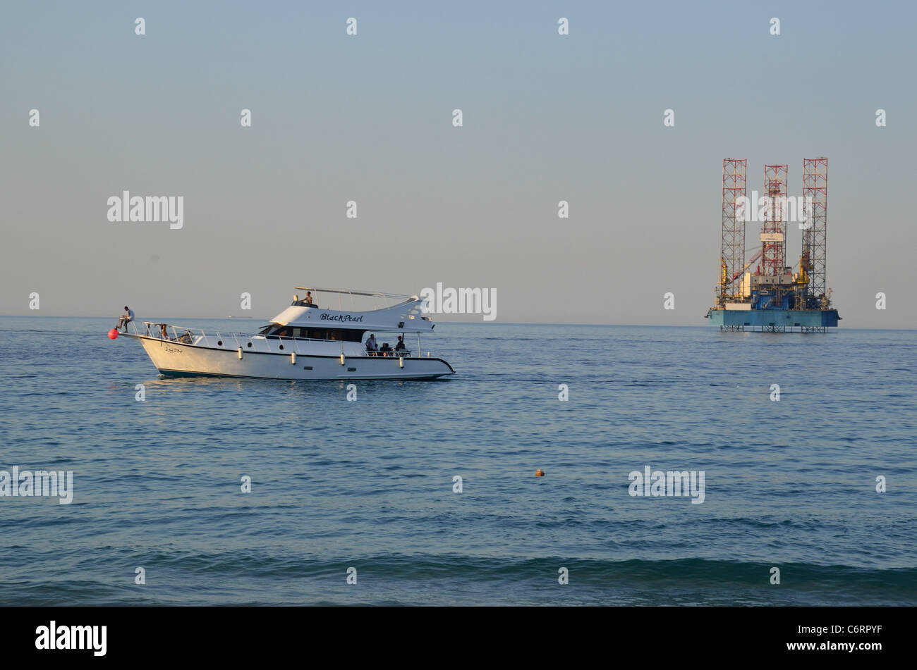 A jackup oil rig lies in the shallow waters of the Red Sea off the ...