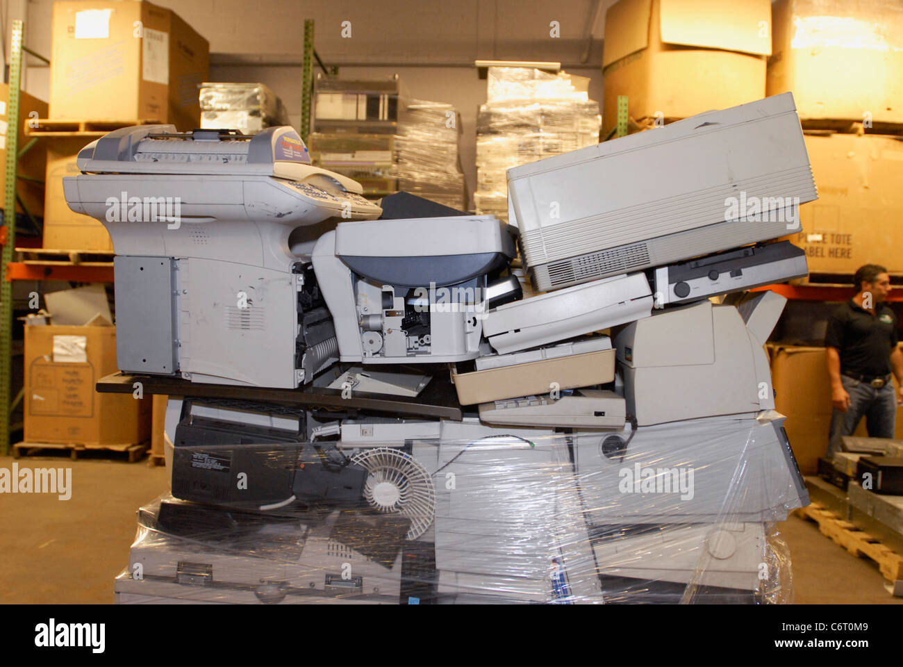 Electronic office equipment ready for recycling at a facility on Long ...