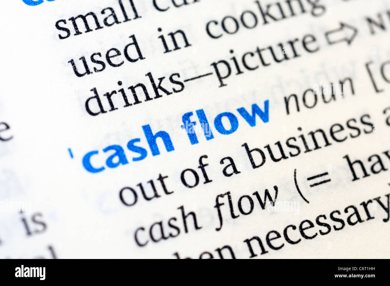 CASH FLOW word closeup in dictionary Stock Photo - Alamy