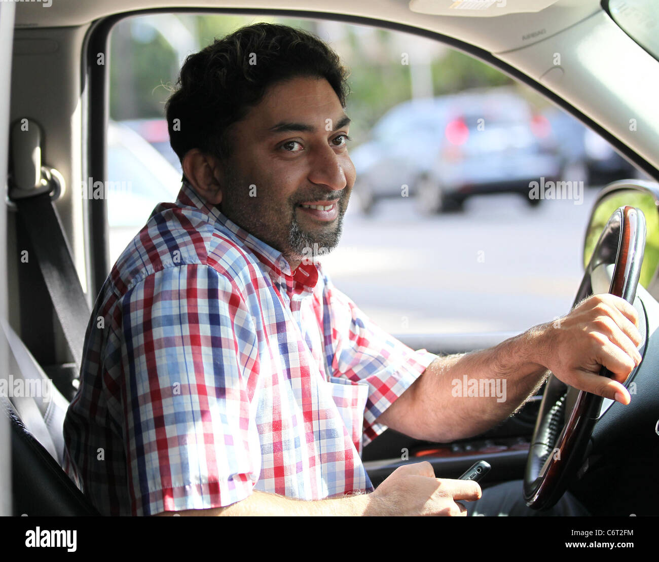 Hollywood.tv founder Sheeraz Hasan driving his car in Beverly Hills ...
