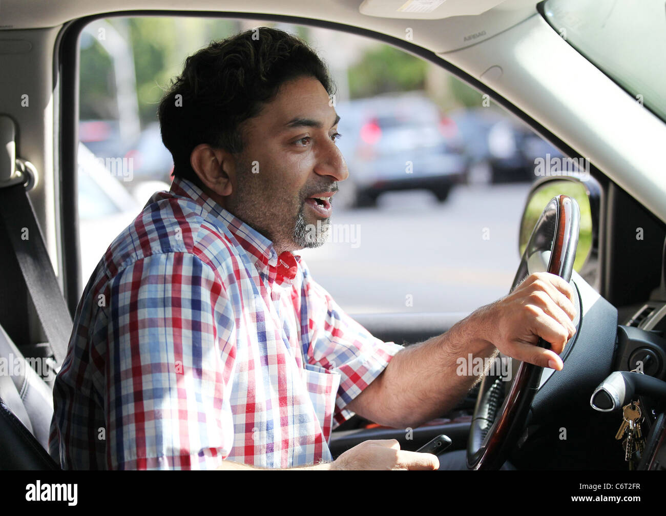 Hollywood.tv founder Sheeraz Hasan driving his car in Beverly Hills ...