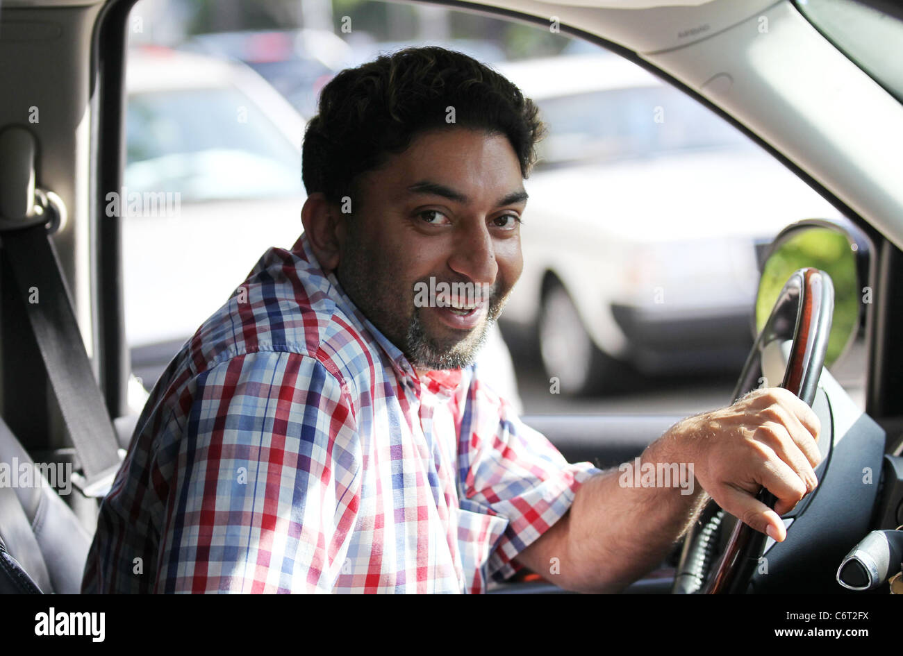 Hollywood.tv founder Sheeraz Hasan driving his car in Beverly Hills ...