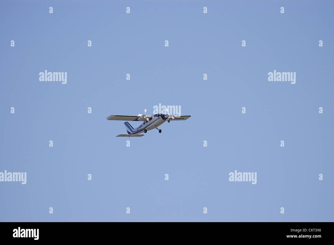 Twin engined propeller aircraft in flight Stock Photo - Alamy