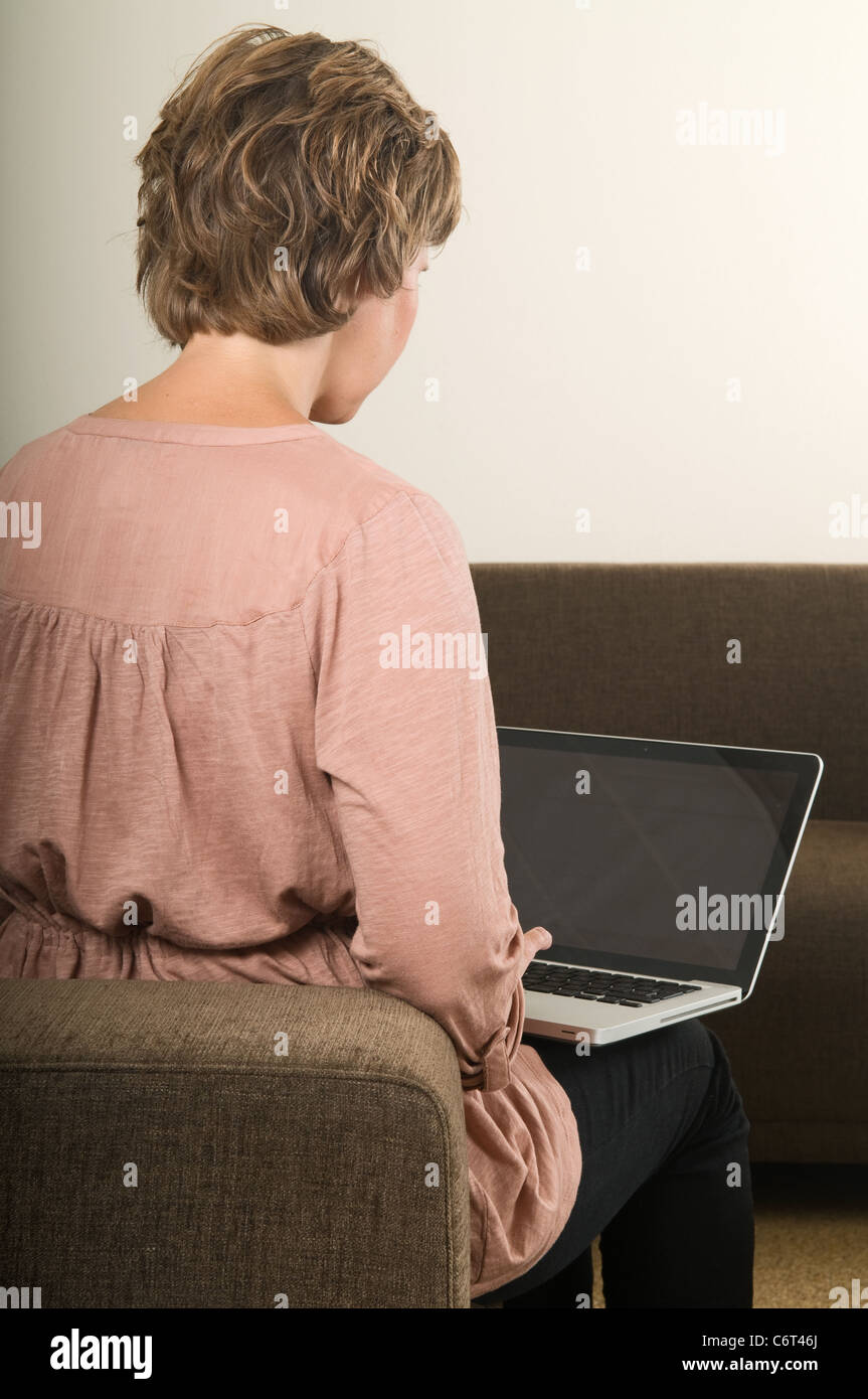 Female on computer from behind hi-res stock photography and images - Alamy