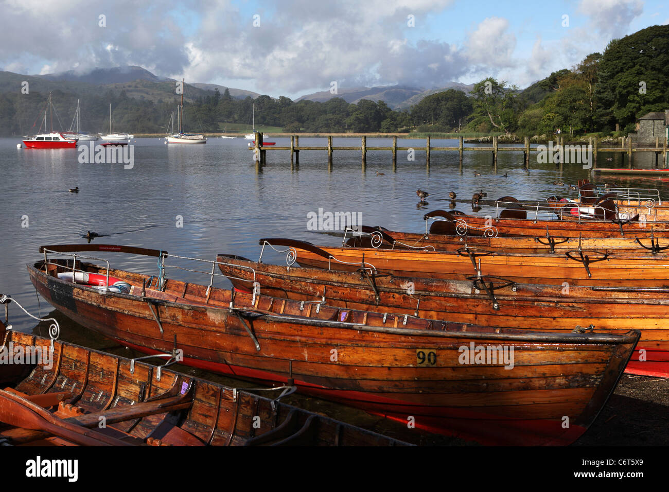 [Rowing boats] and [sailing yachts] in morning sun on [Lake Windermere ...