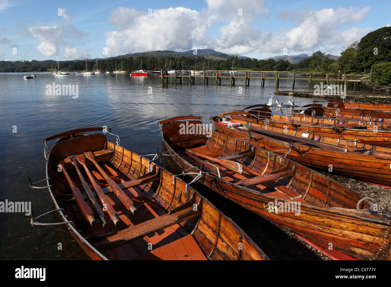 [Rowing boats] and [sailing yachts] in morning sun on [Lake Windermere ...