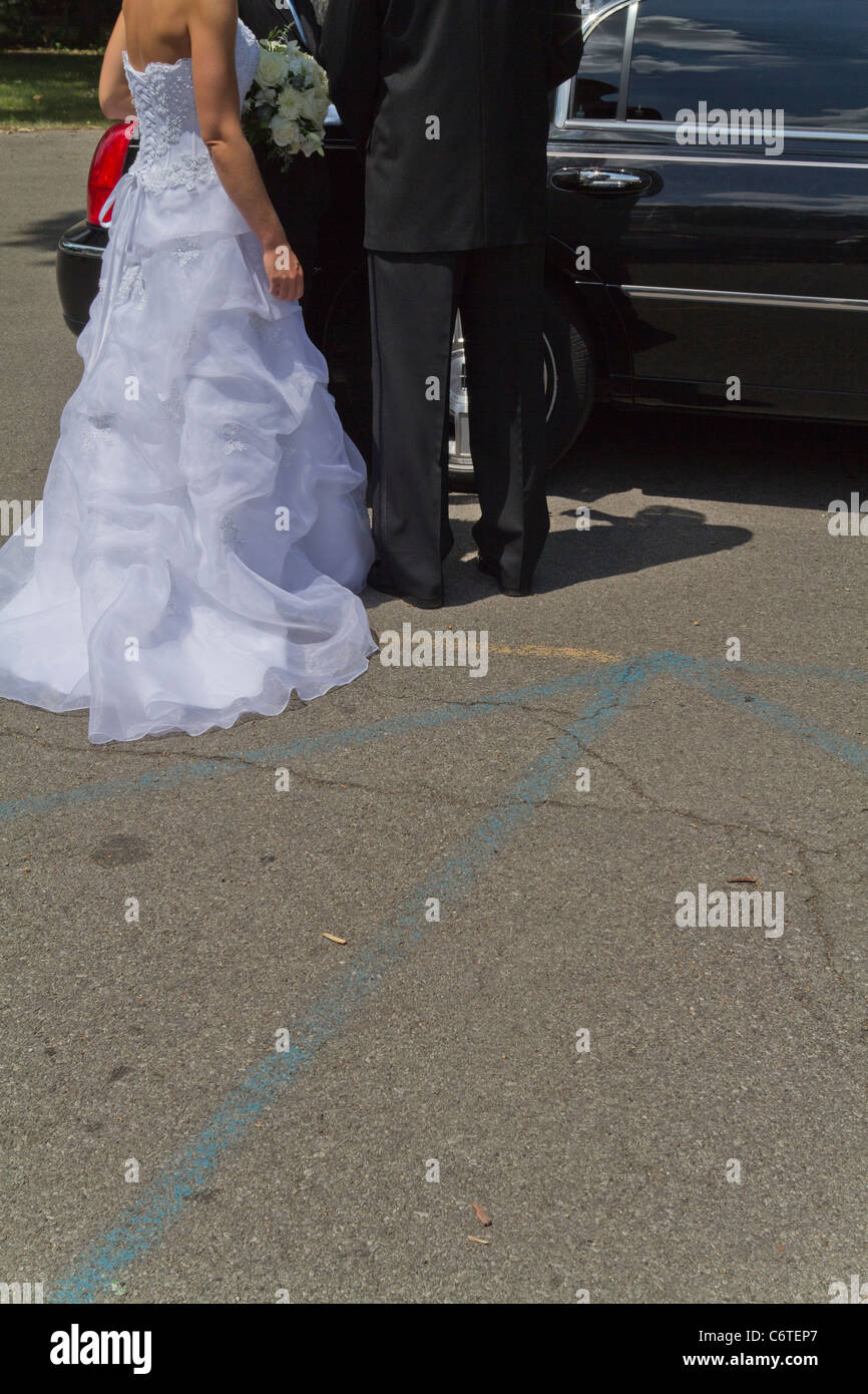 Wedding couple bride with groom outside rear view in Ohio USA US ...