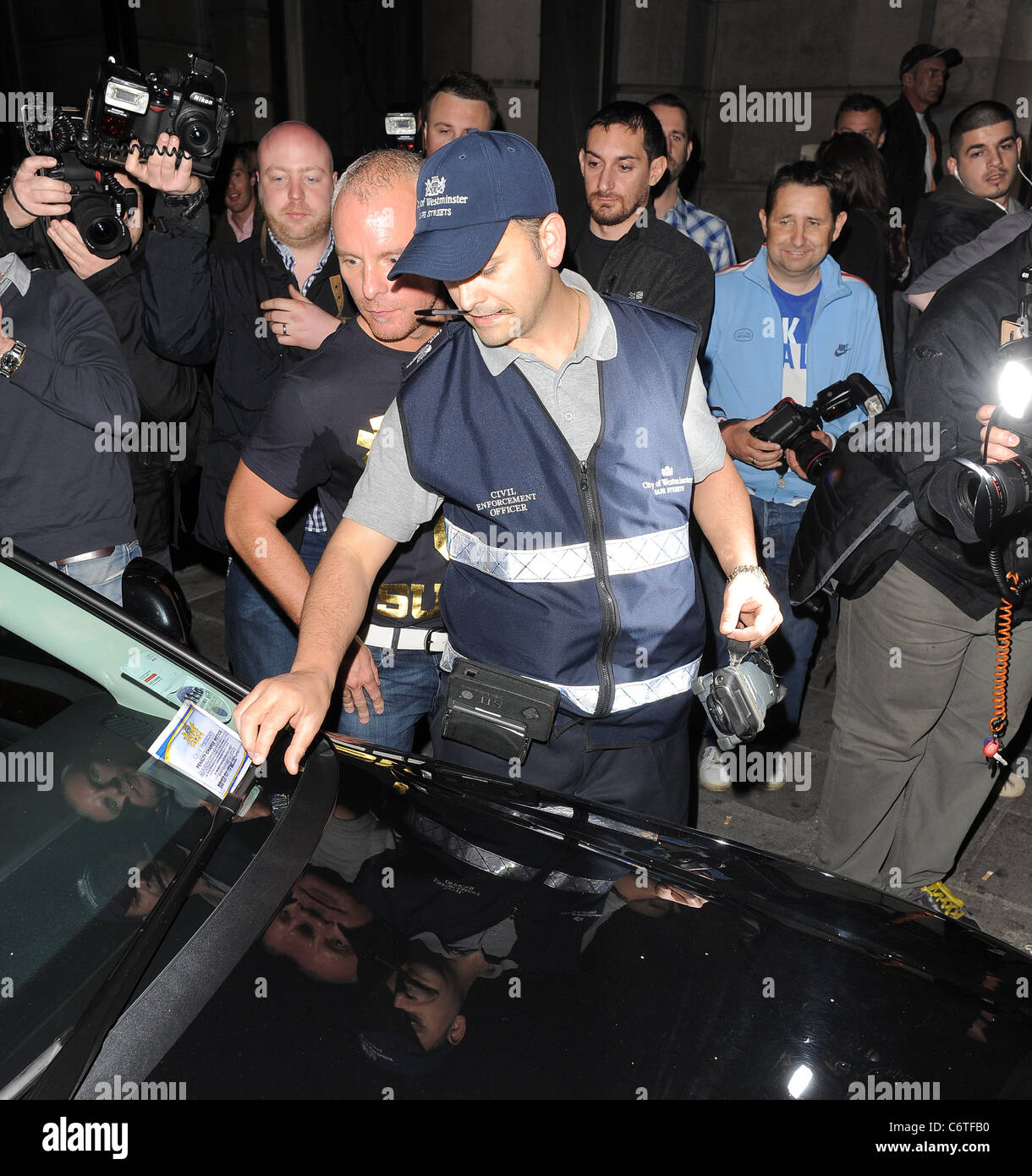 Madonna is escorted out of Aura nightclub by her personal bodyguard ...