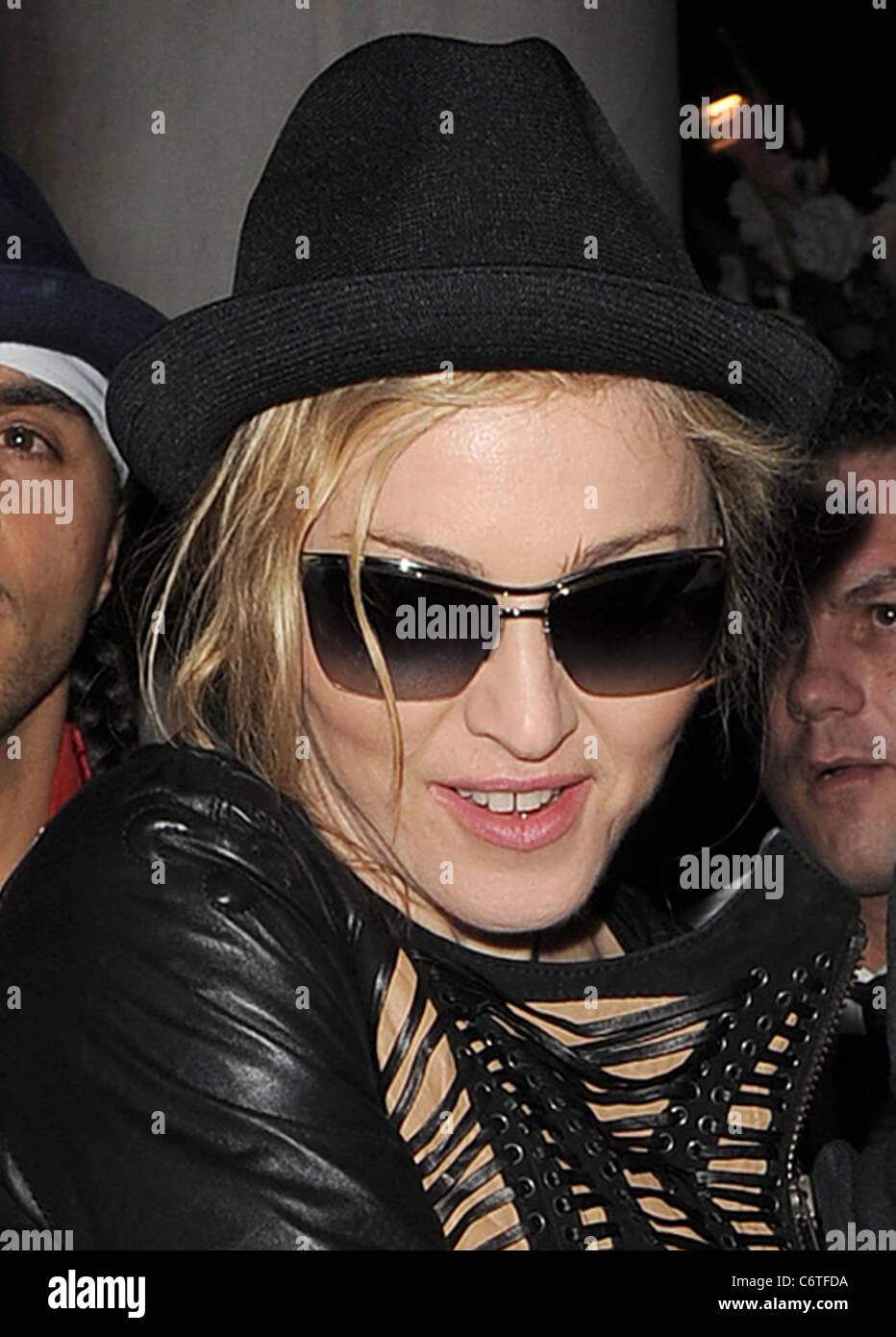 Madonna is escorted out of Aura nightclub by her personal bodyguard ...