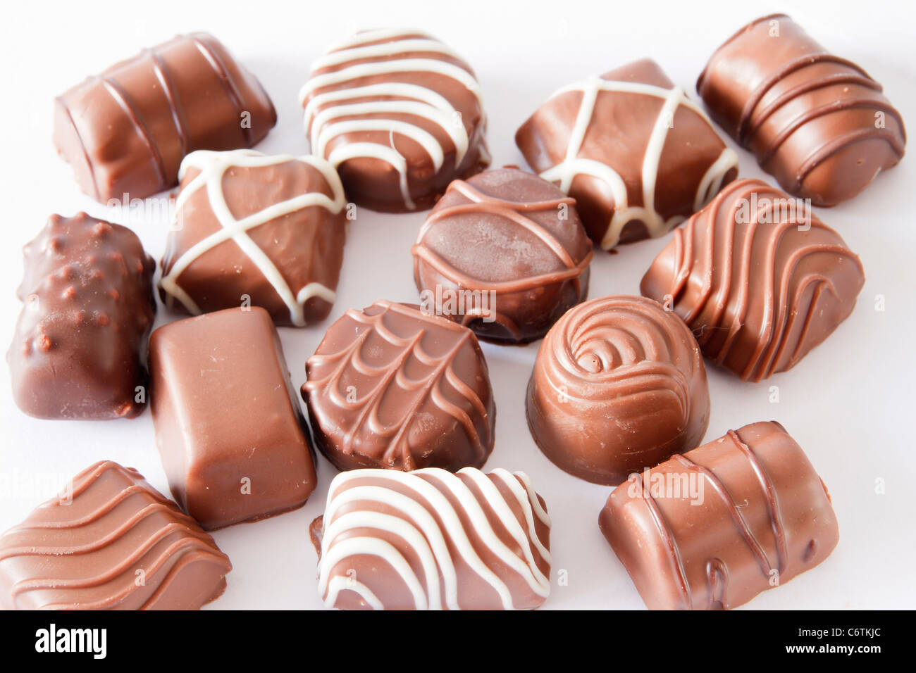 assorted chocolate pralines isolated on white Stock Photo - Alamy