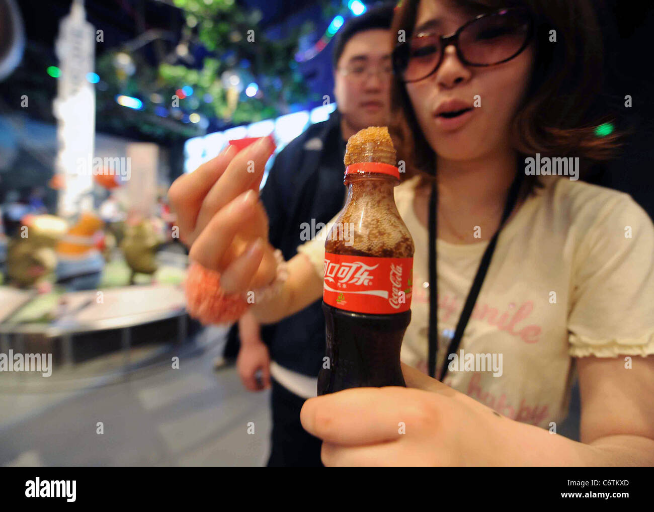 Icy Coca-Cola Visitors to the 2010 Shanghai Expo in China are given a ...