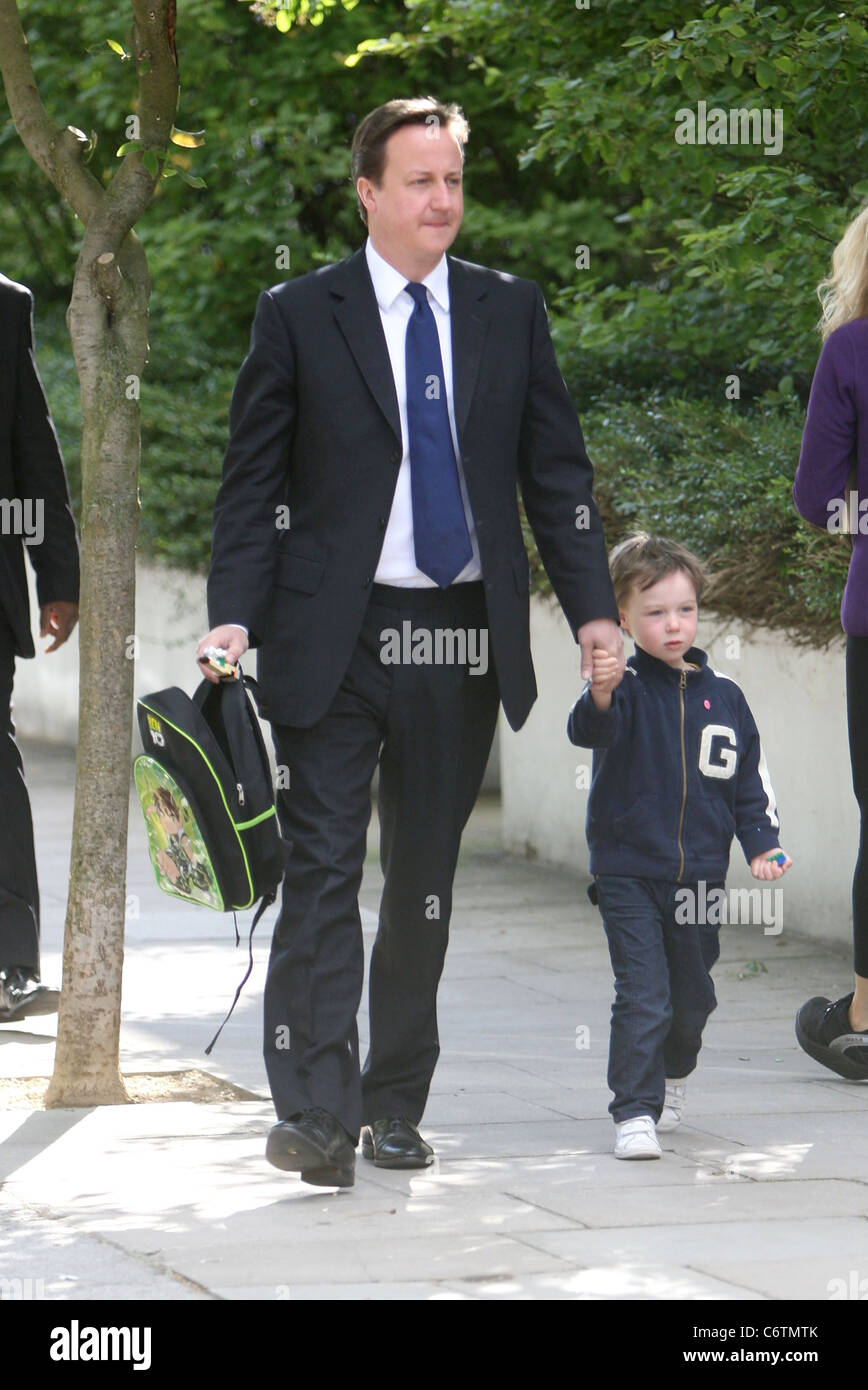 Prime Minister David Cameron walking his son Arthur to school London ...