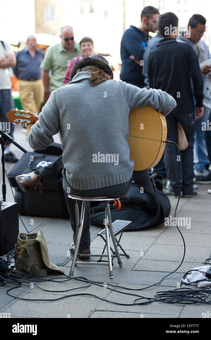 Male member of multicultural band "Fernando's Kitchen" playing guitar ...