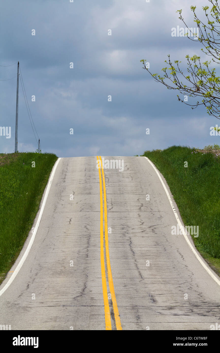 Closeup of the rural road.The landscape with blue skies outside horizon ...