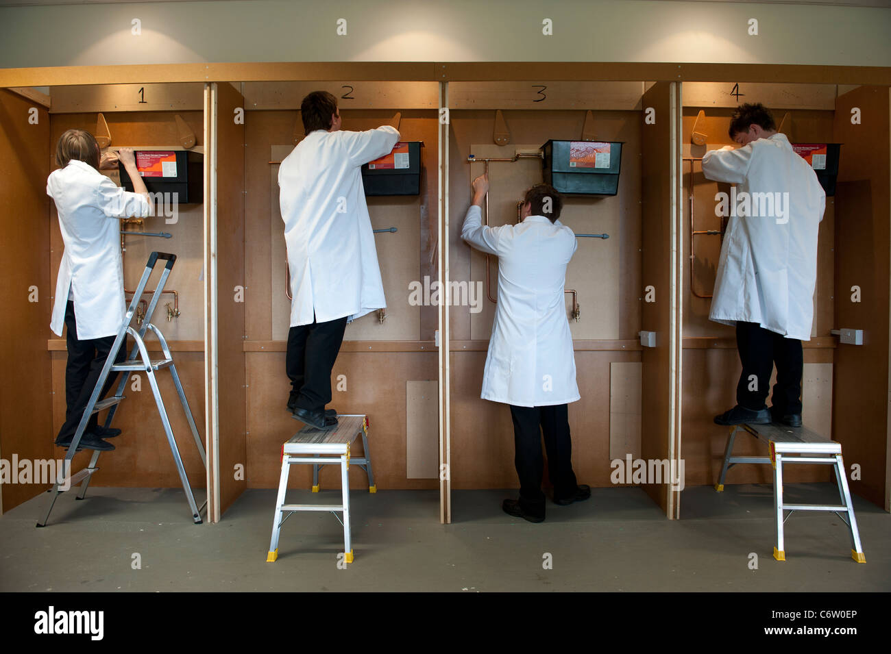 Pupils at a UK secondary school learn how to be plumbers Stock Photo ...