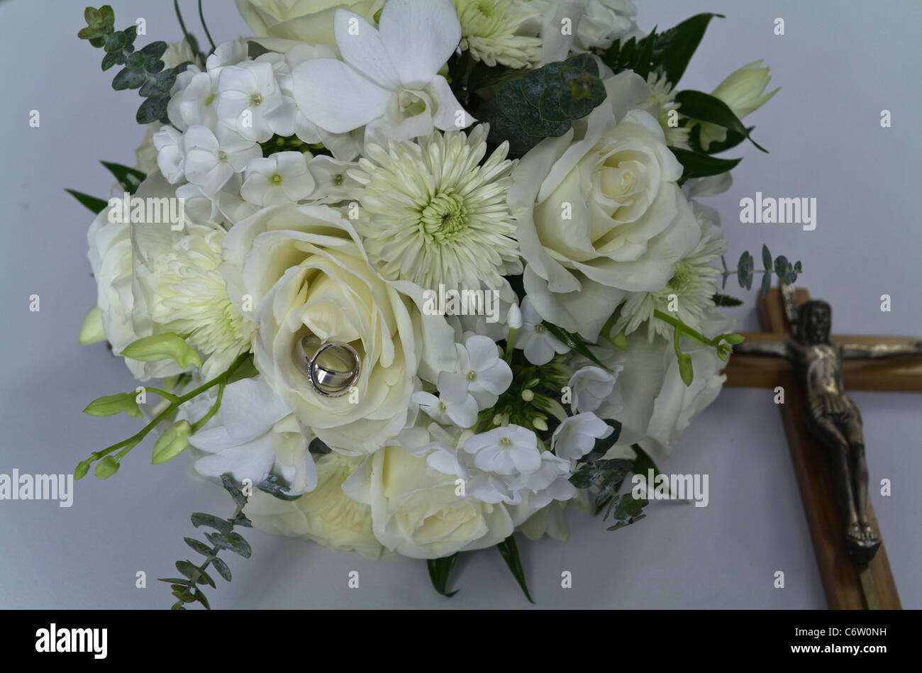 The preparing for the Catholic wedding bouquet of white roses with ...