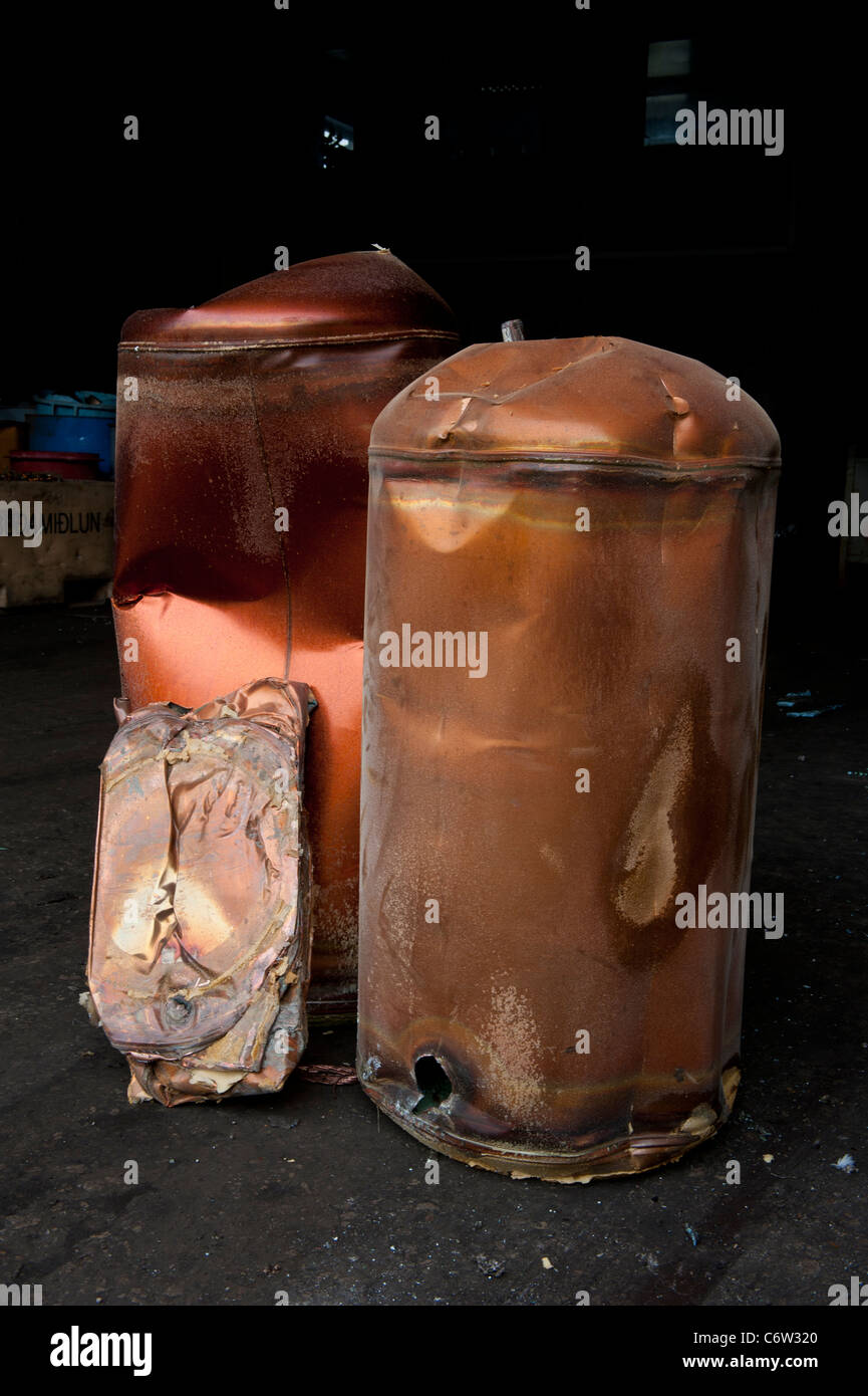 Scrap metal waiting to be recycled. Copper water immersion tanks. At ...