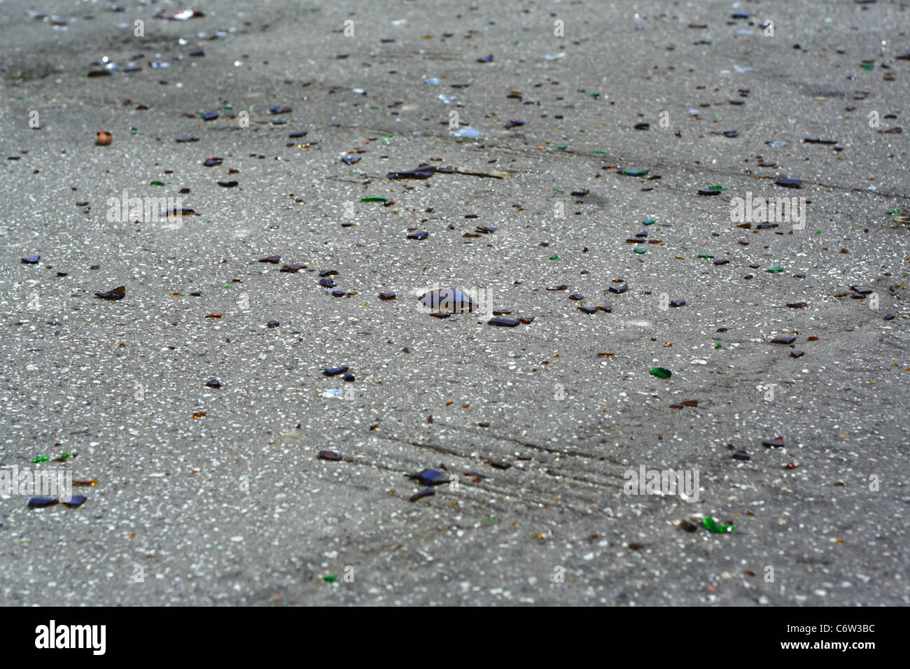 Broken glass on asphalt Stock Photo - Alamy