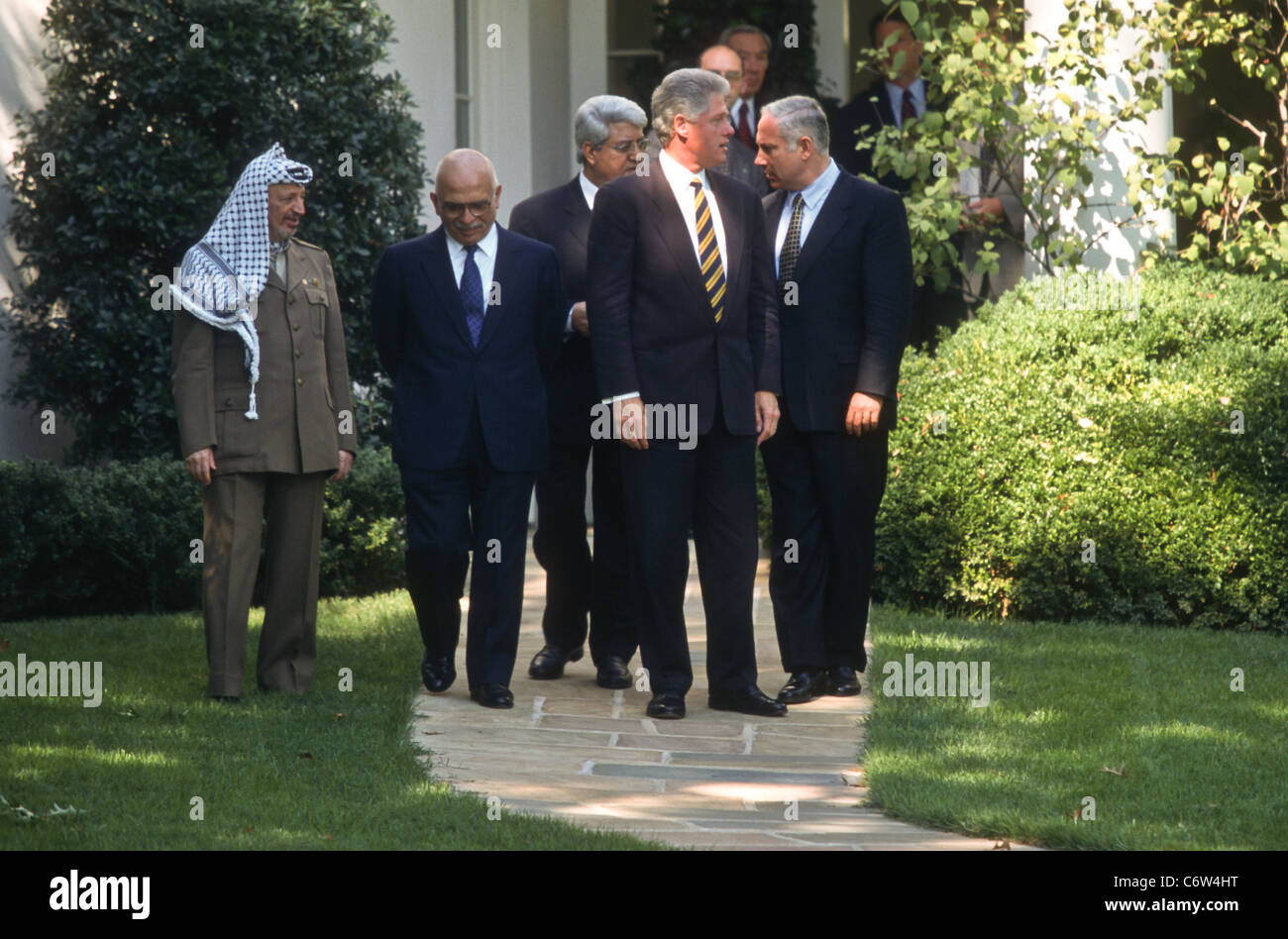 President Bill Clinton walks with PLO Yasser Arafat, Israeli Prime ...