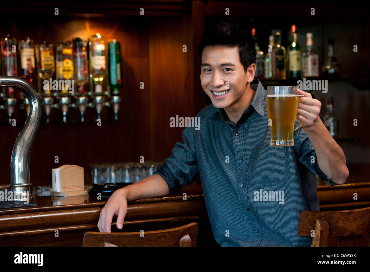 A Man Relaxing at a Bar Stock Photo - Alamy