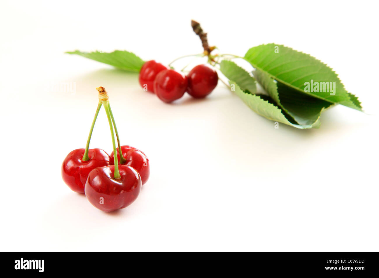 fresh red cherry on white background Stock Photo - Alamy