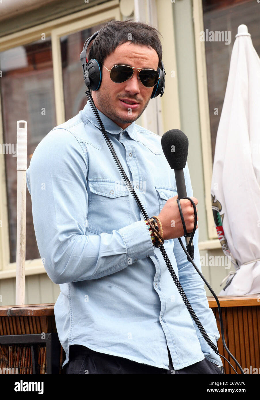 Jack Tweed records a feature outside the ITV Studios London, England ...