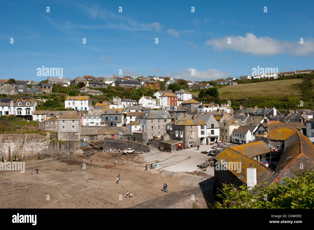 Tourists visiting the pretty seaside fishing village of Port Isaac in ...