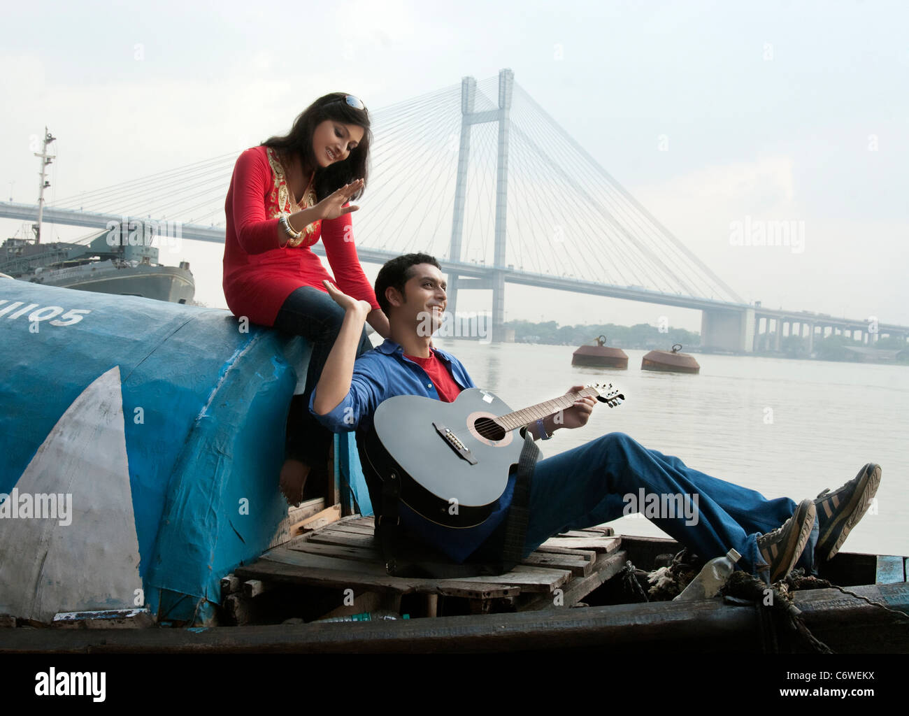 Couple enjoying on a boat Stock Photo - Alamy
