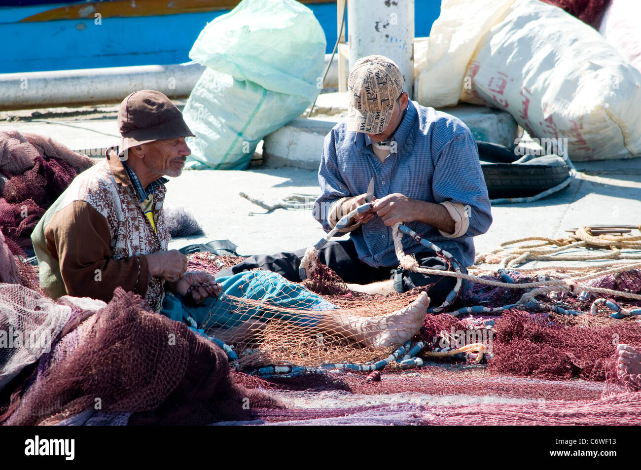 Mending fish net hi-res stock photography and images - Alamy