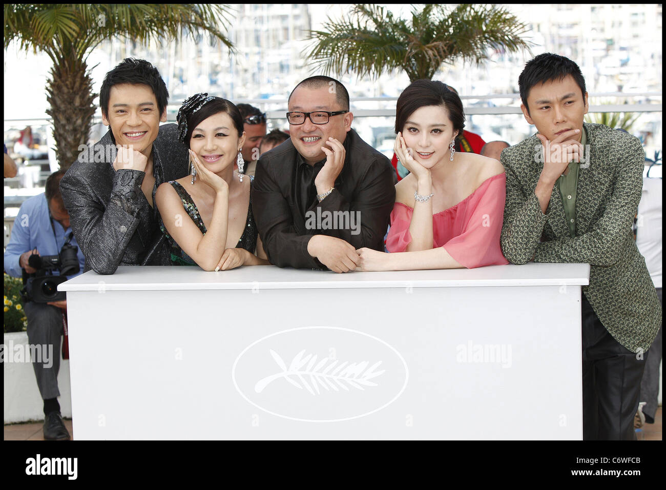 Director Wang Xiaoshuai (C) poses with Chinese actress Fan Bingbing ...