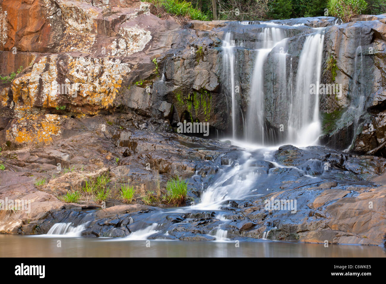 image of waterfall cascading into pond Stock Photo - Alamy