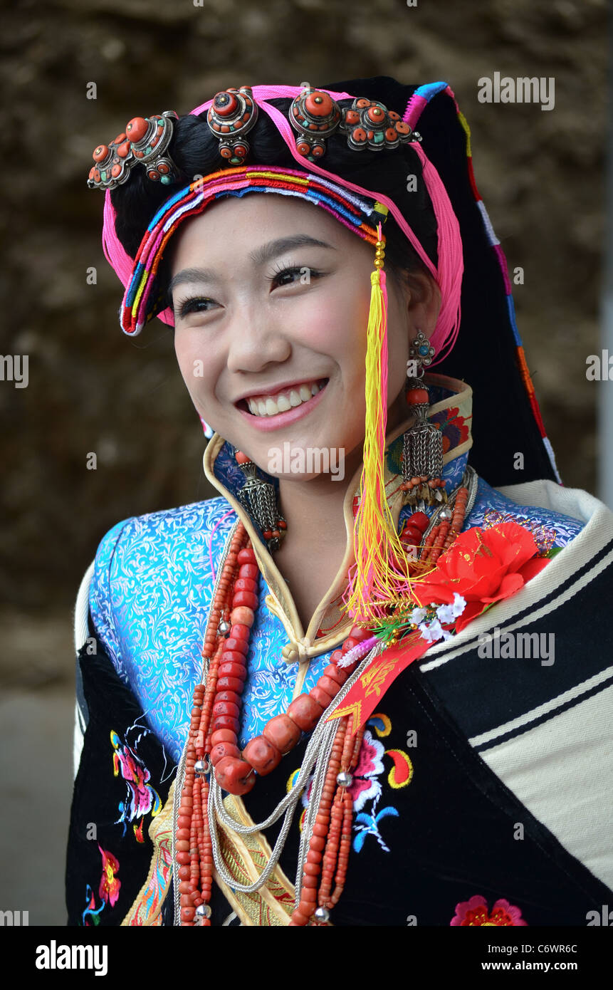 A Tibetan (Jiarong) bridesmaid wearing traditional dress at a wedding ...