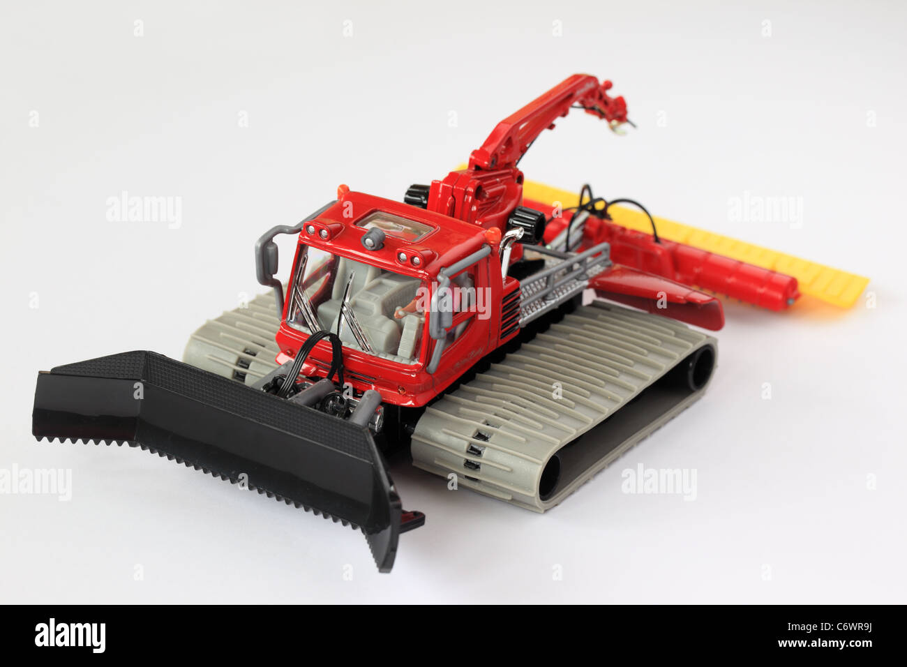Toy Piste Basher model against a white background Stock Photo - Alamy