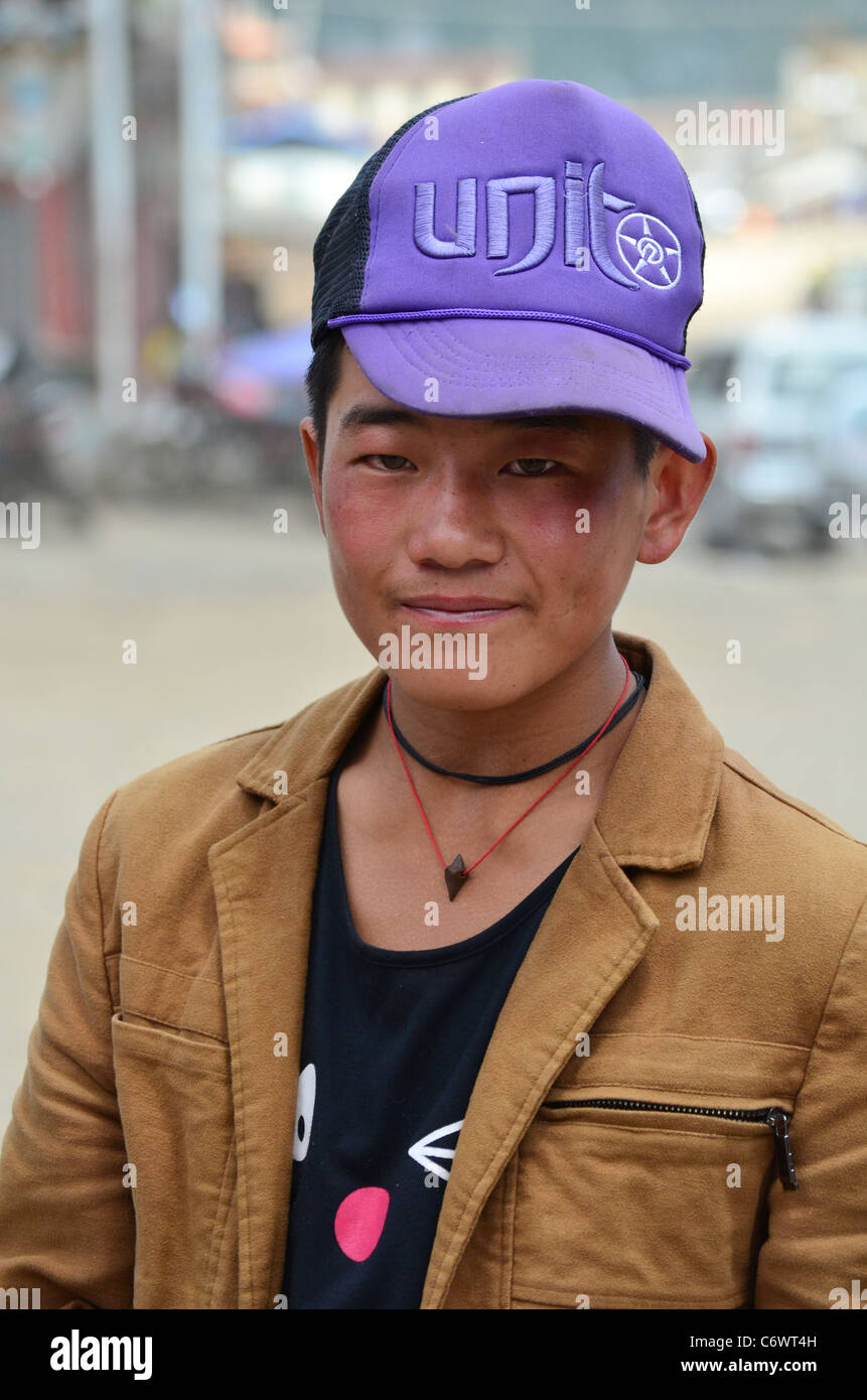 A Tibetan boy (young man) in trendy baseball cap, Manigango (also ...