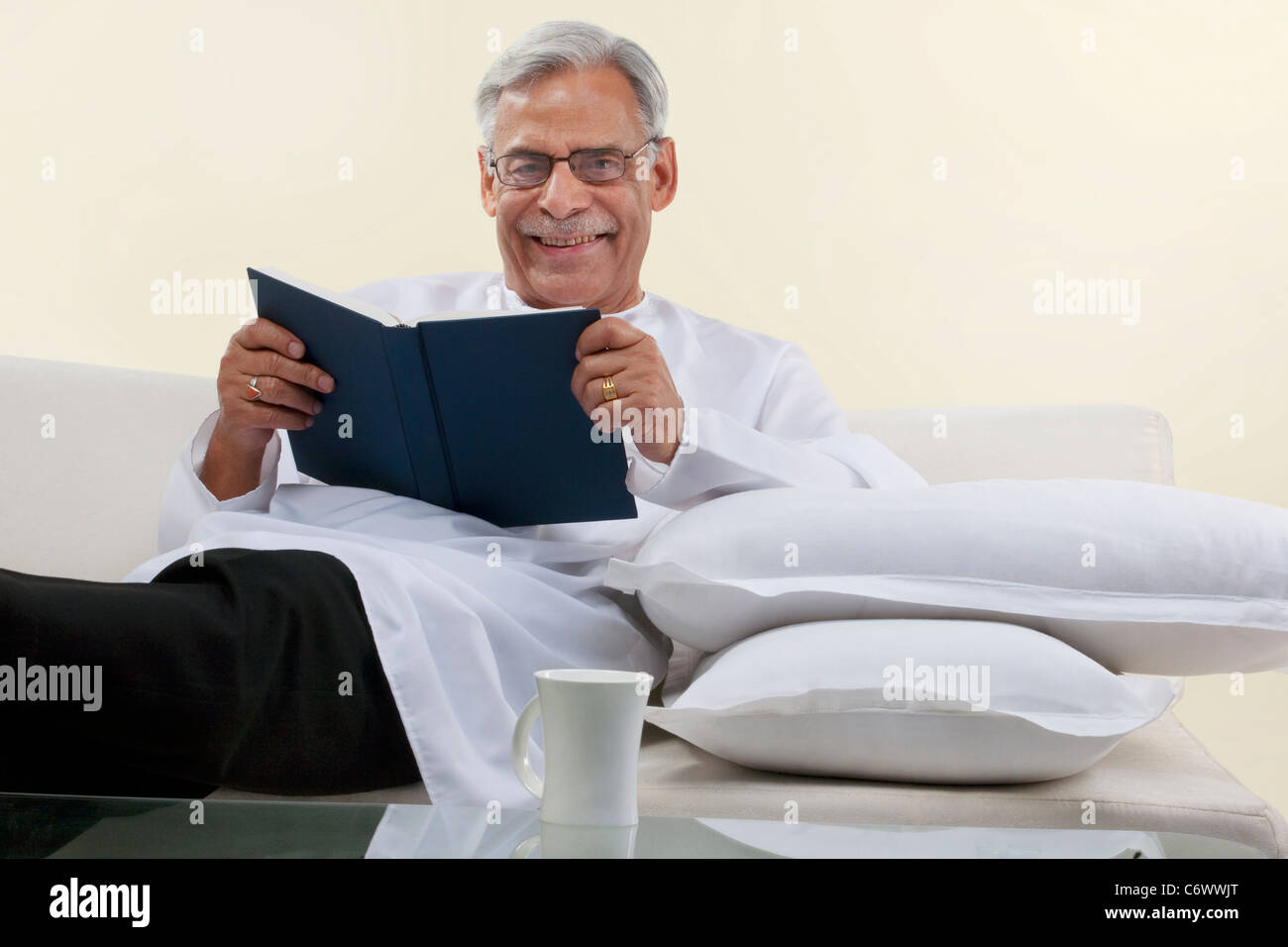 Portrait of an old man with a book Stock Photo - Alamy