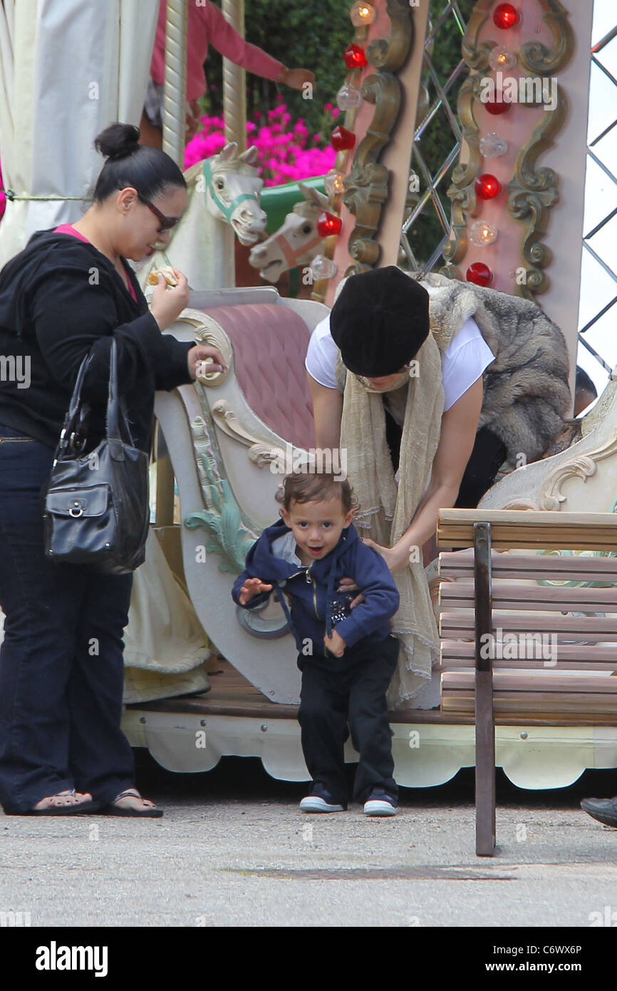 Jennifer Lopez with her twins Emma and Max enjoy a ride on the carousel ...