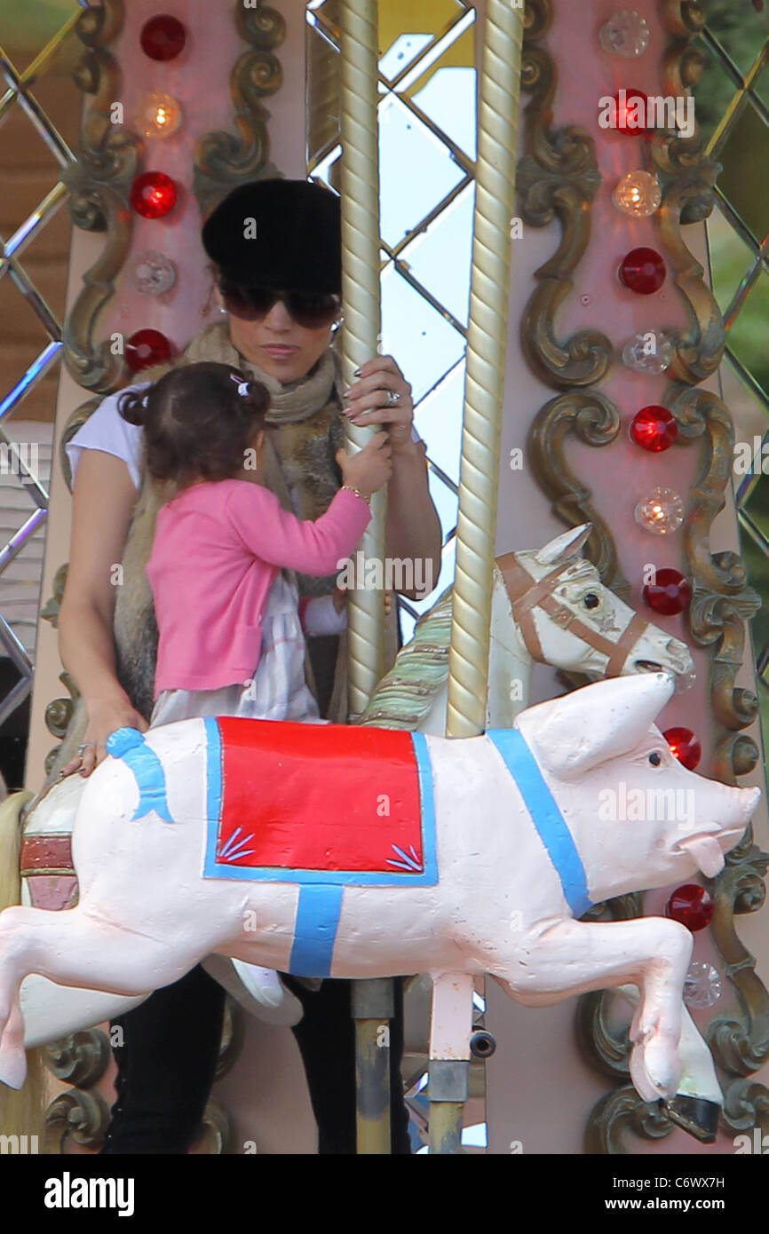 Jennifer Lopez with her twins Emma and Max enjoy a ride on the carousel ...