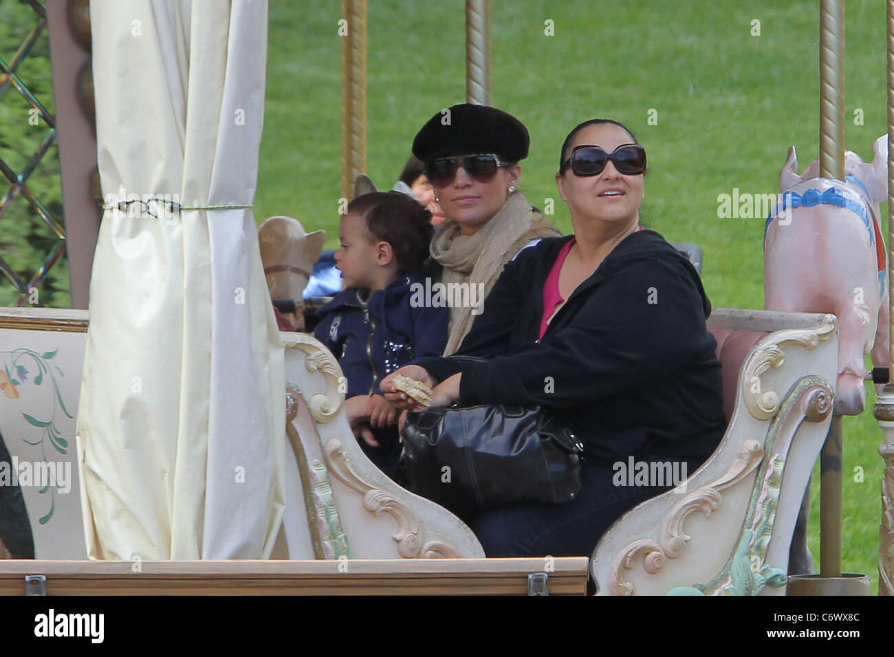 Jennifer Lopez with her twins Emma and Max enjoy a ride on the carousel ...