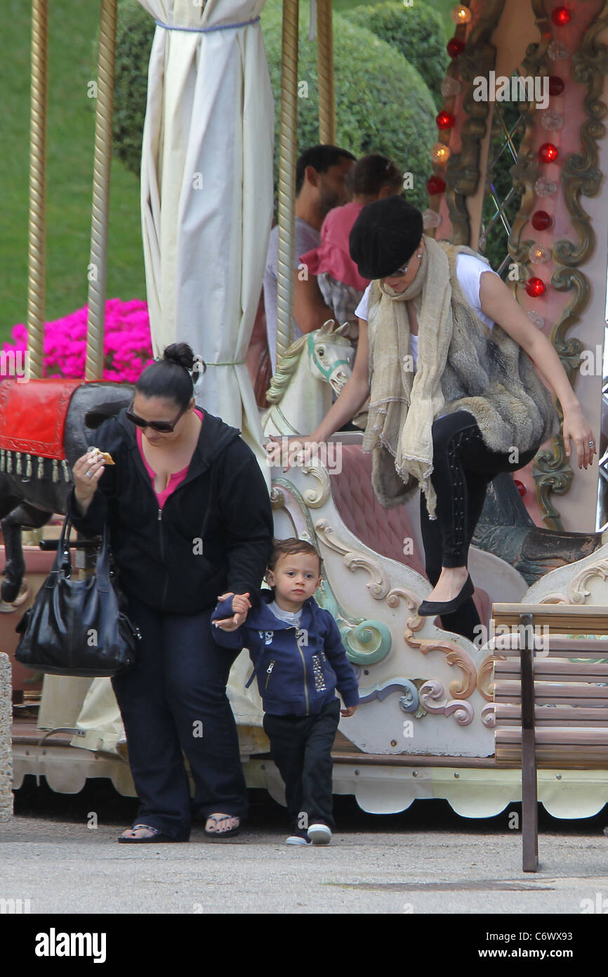 Jennifer Lopez with her twins Emma and Max enjoy a ride on the carousel ...