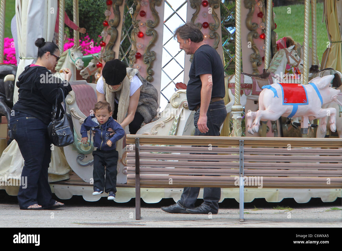 Jennifer Lopez with her twins Emma and Max enjoy a ride on the carousel ...