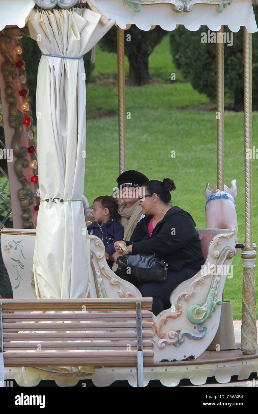 Jennifer Lopez with her twins Emma and Max enjoy a ride on the carousel ...