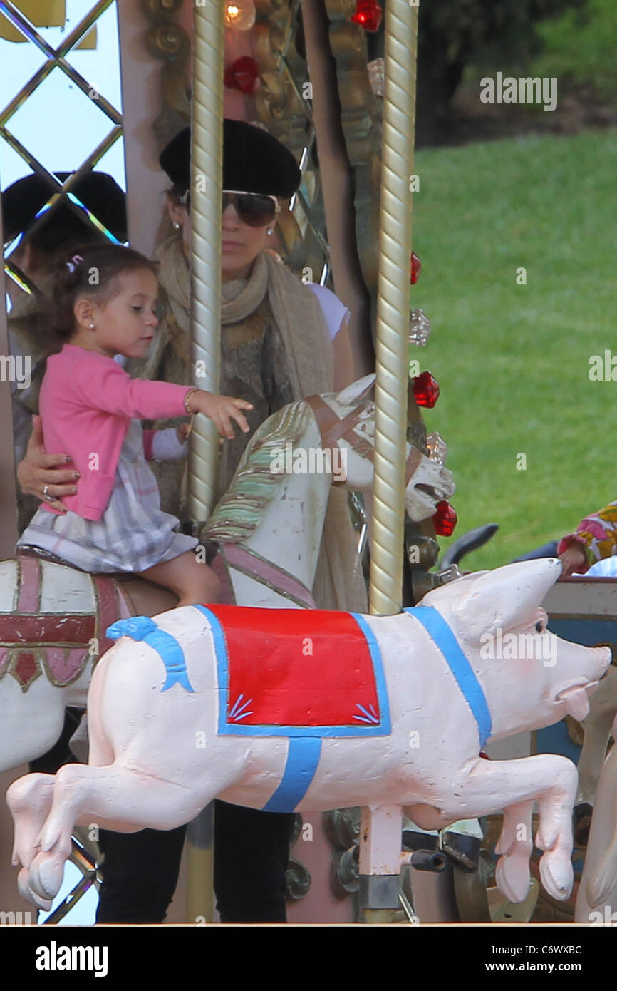 Jennifer Lopez with her twins Emma and Max enjoy a ride on the carousel ...
