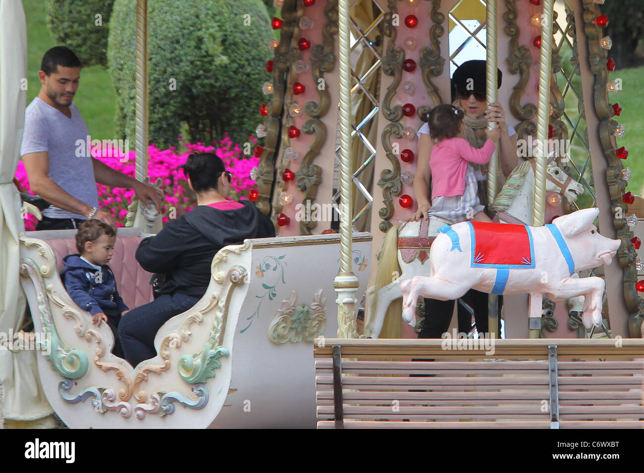 Jennifer Lopez with her twins Emma and Max enjoy a ride on the carousel ...