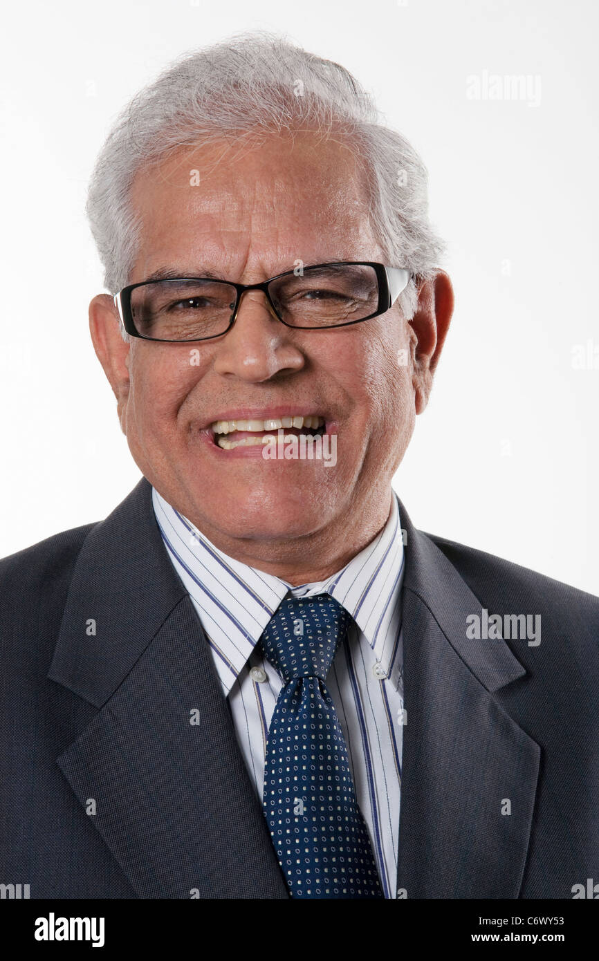 Portrait of an old businessman smiling Stock Photo - Alamy