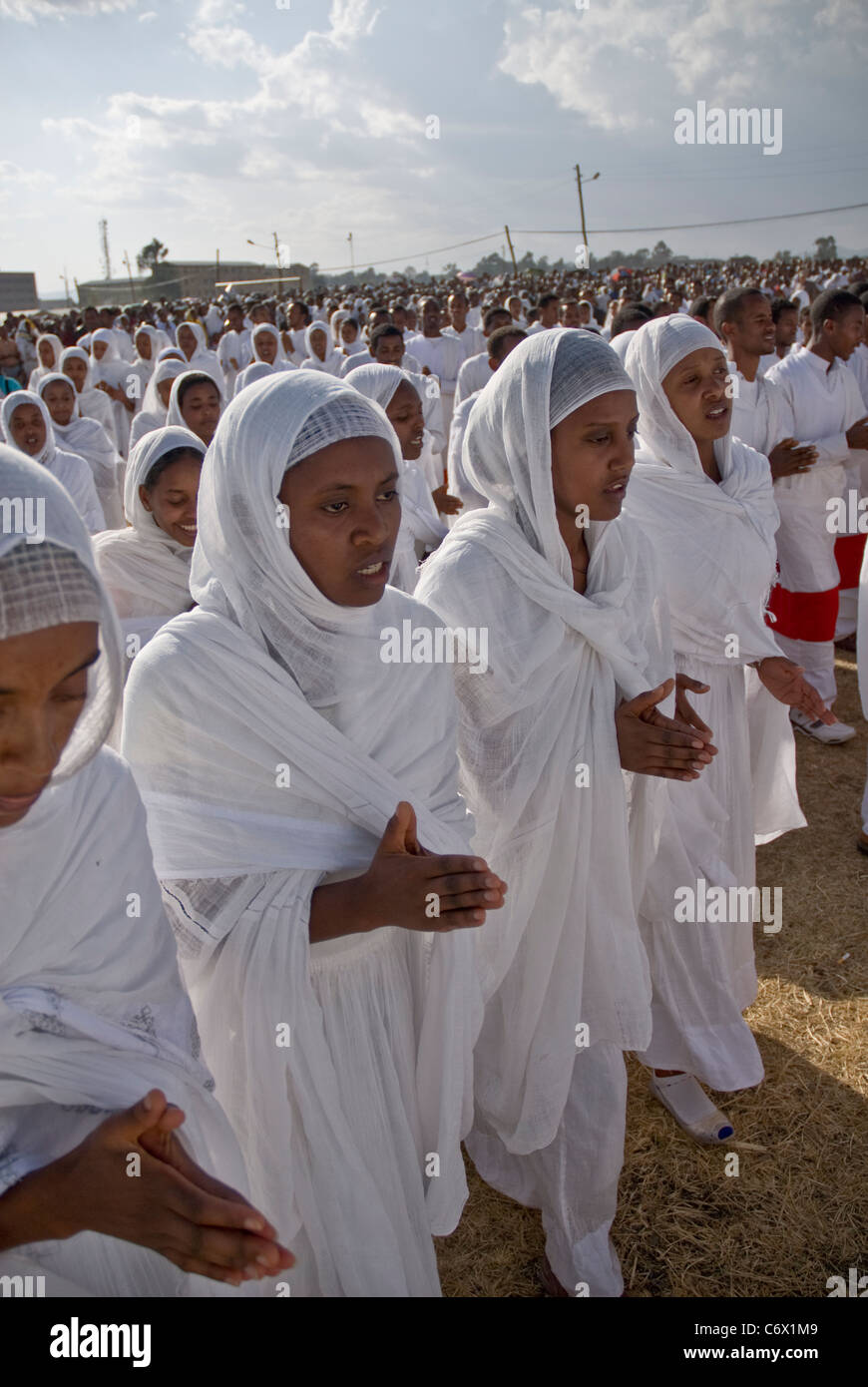 Christian Orthodox devotees singing and clapping as they arrive at the ...