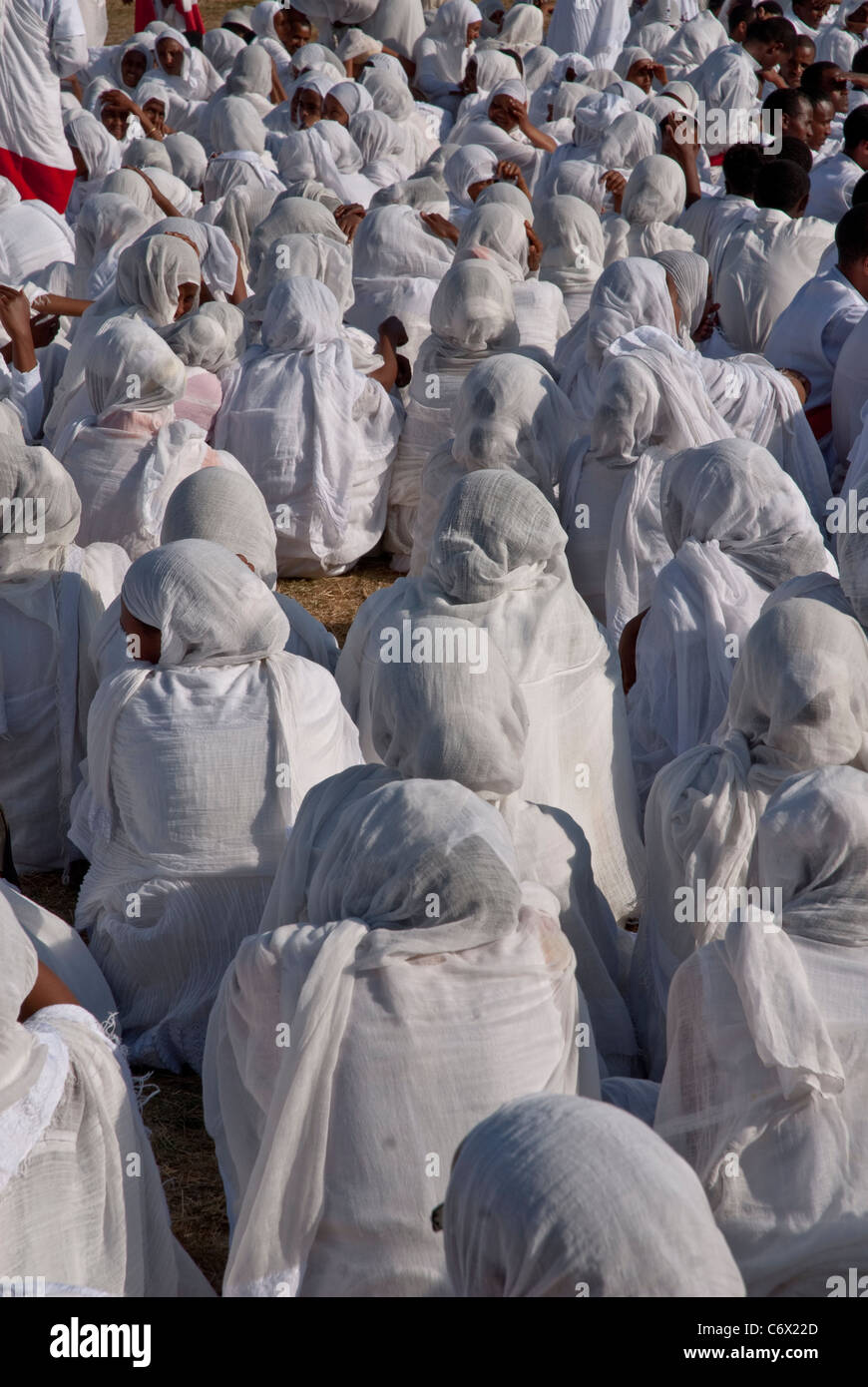 Christian Orthodox devotees sitting at the Temket Festival celebrations ...